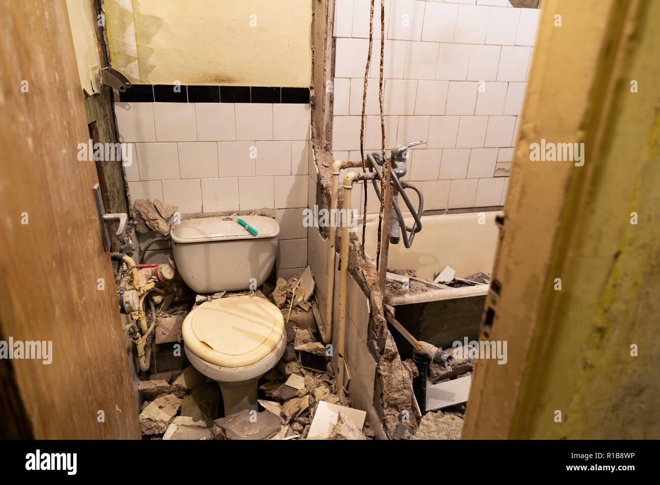 old demolished apartment toilet Stock Photo - Alamy