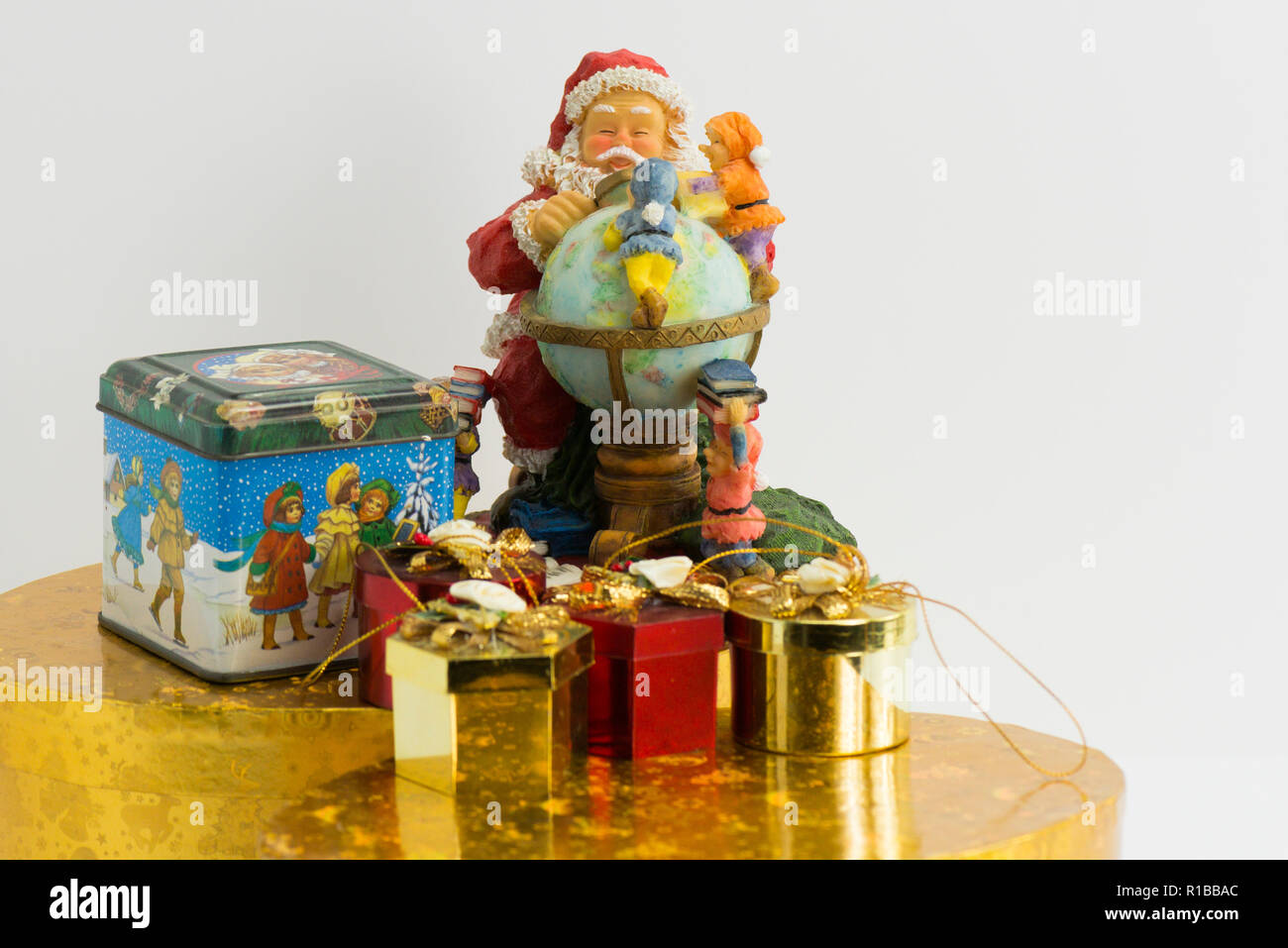 A Father Christmas ornament, a Christmas tin and Christmas tree ...