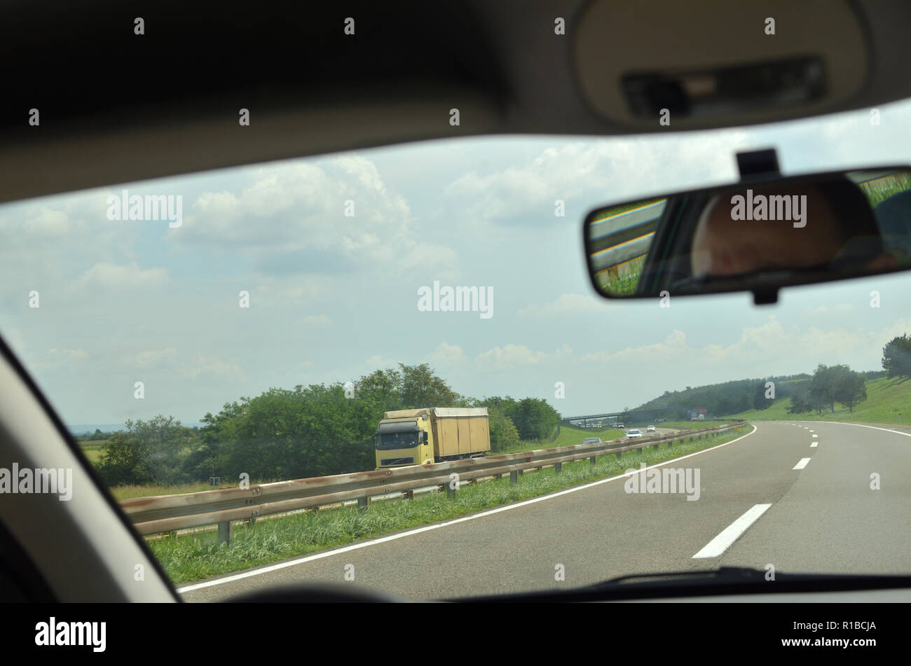 Driving on a highway with other vehicles in opposite direction Stock ...