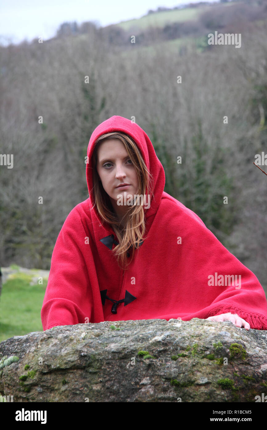 Girl in red cape Stock Photo - Alamy