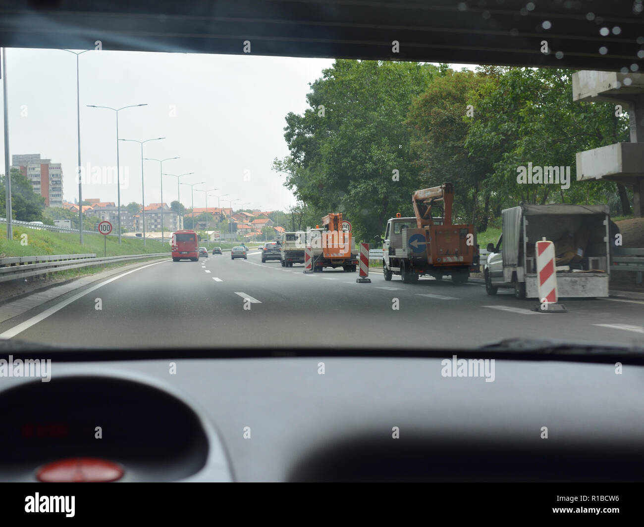 Driving on a highway with a right lane work in progress Stock Photo - Alamy