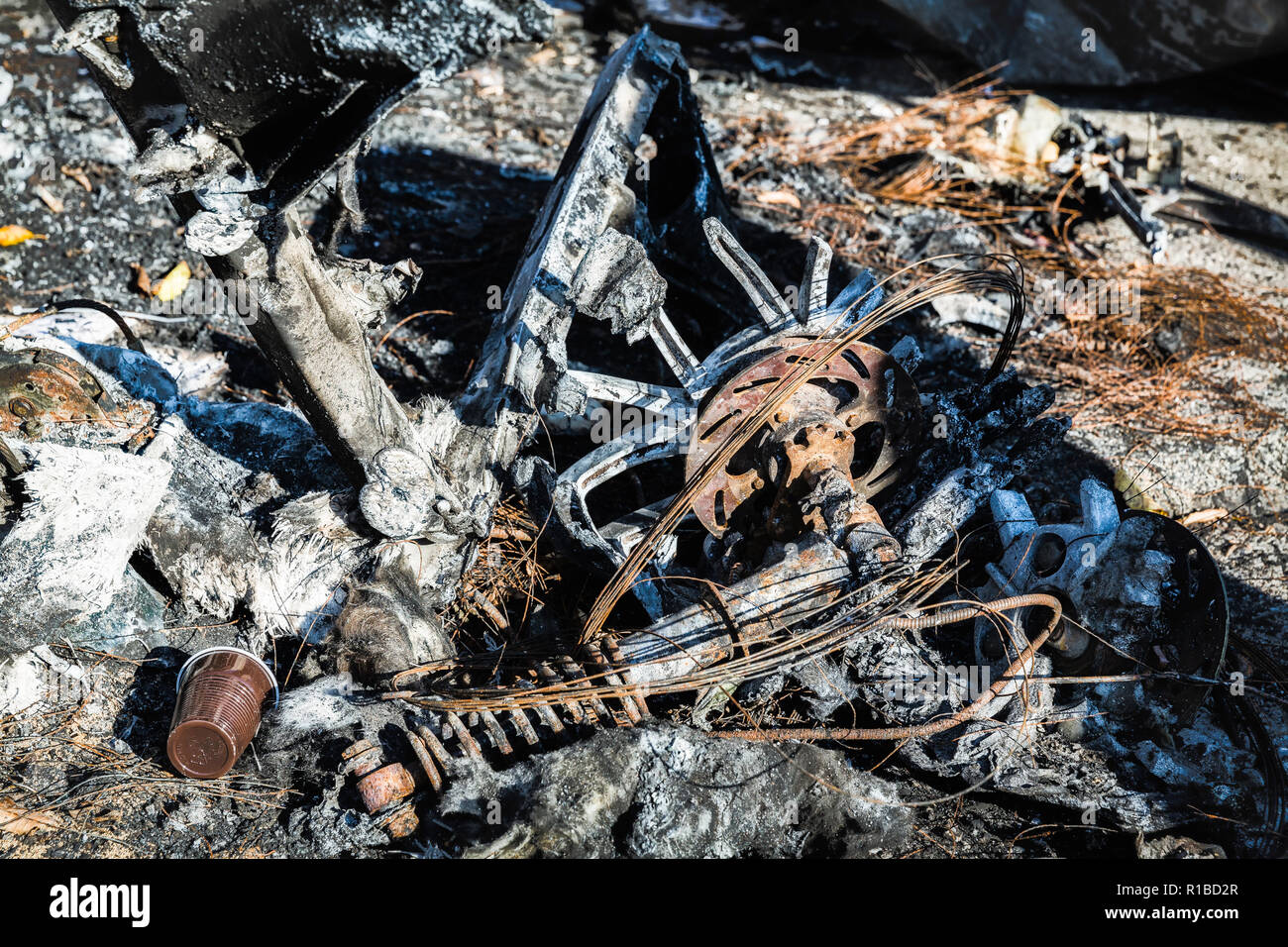 damaged burnt car metallic after arson fire with burnt debris after ...