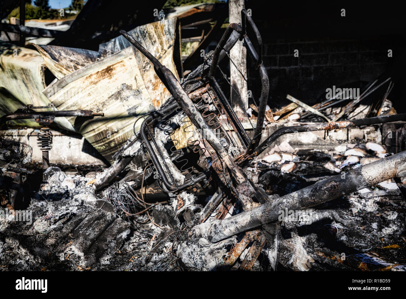 damaged burnt car metallic after arson fire with burnt debris after ...