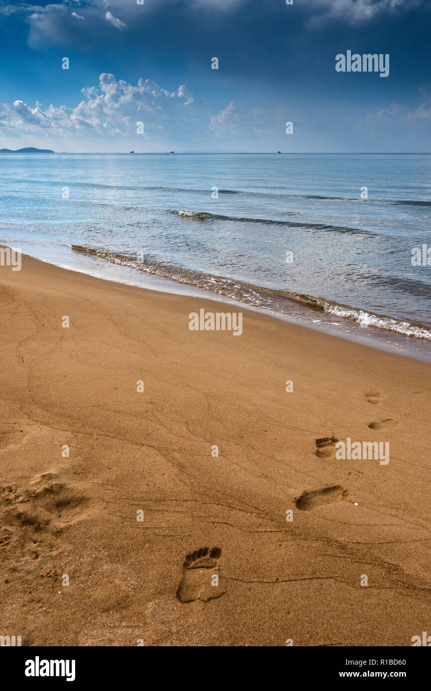 Sandy beach with footsteps at the unspoilt bird reserve of Kalogria ...