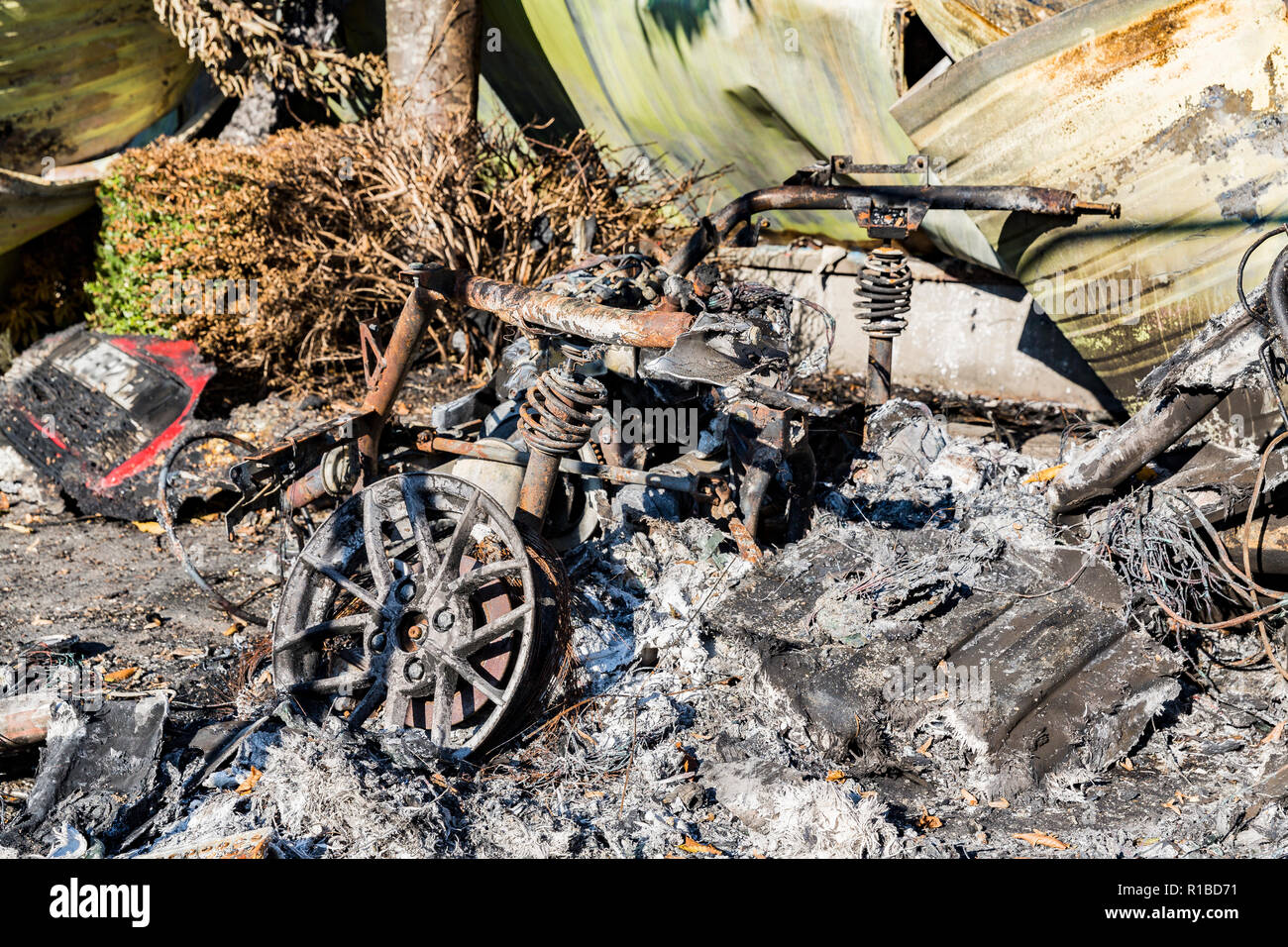 damaged burnt car metallic after arson fire with burnt debris after ...