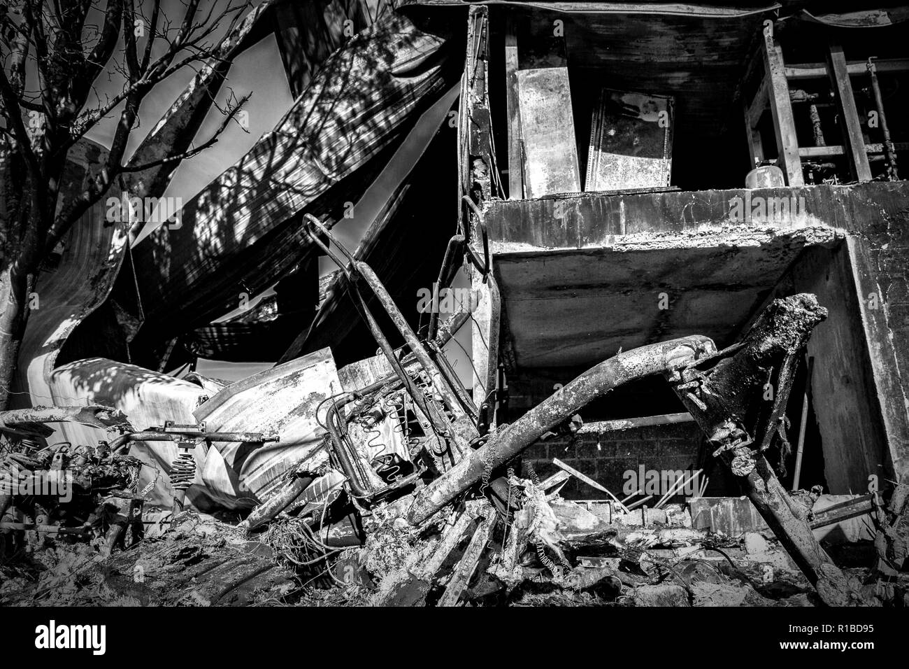damaged burnt car metallic after arson fire with burnt debris after ...