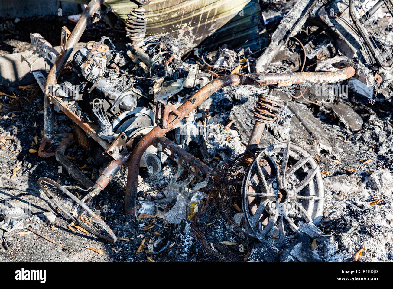 damaged burnt car metallic after arson fire with burnt debris after ...