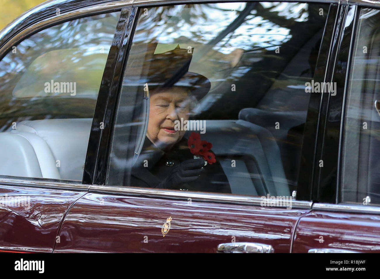 Westminster. London, UK. 11th Nov, 2018. Queen Elizabeth II along with ...