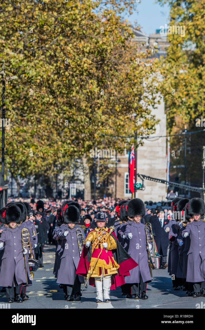 London, UK. 11th Nov 2018. The Guards band leads the parade after the ...