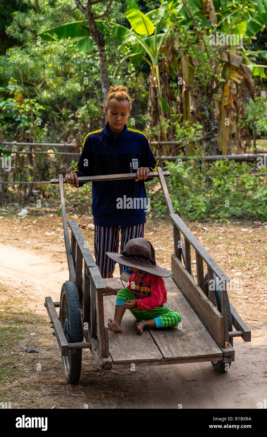 Don Khone, Laos - April 23, 2018: Mother transporting a child on a ...