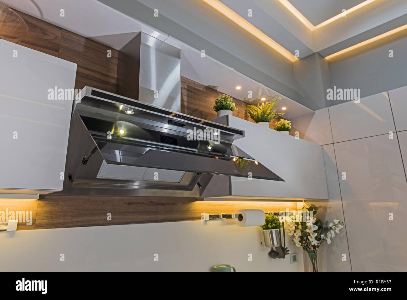 Interior design decor of modern kitchen showing extractor fan appliance ...