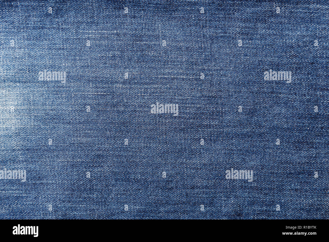 blue old denim background. well visible texture of the fabric. place ...