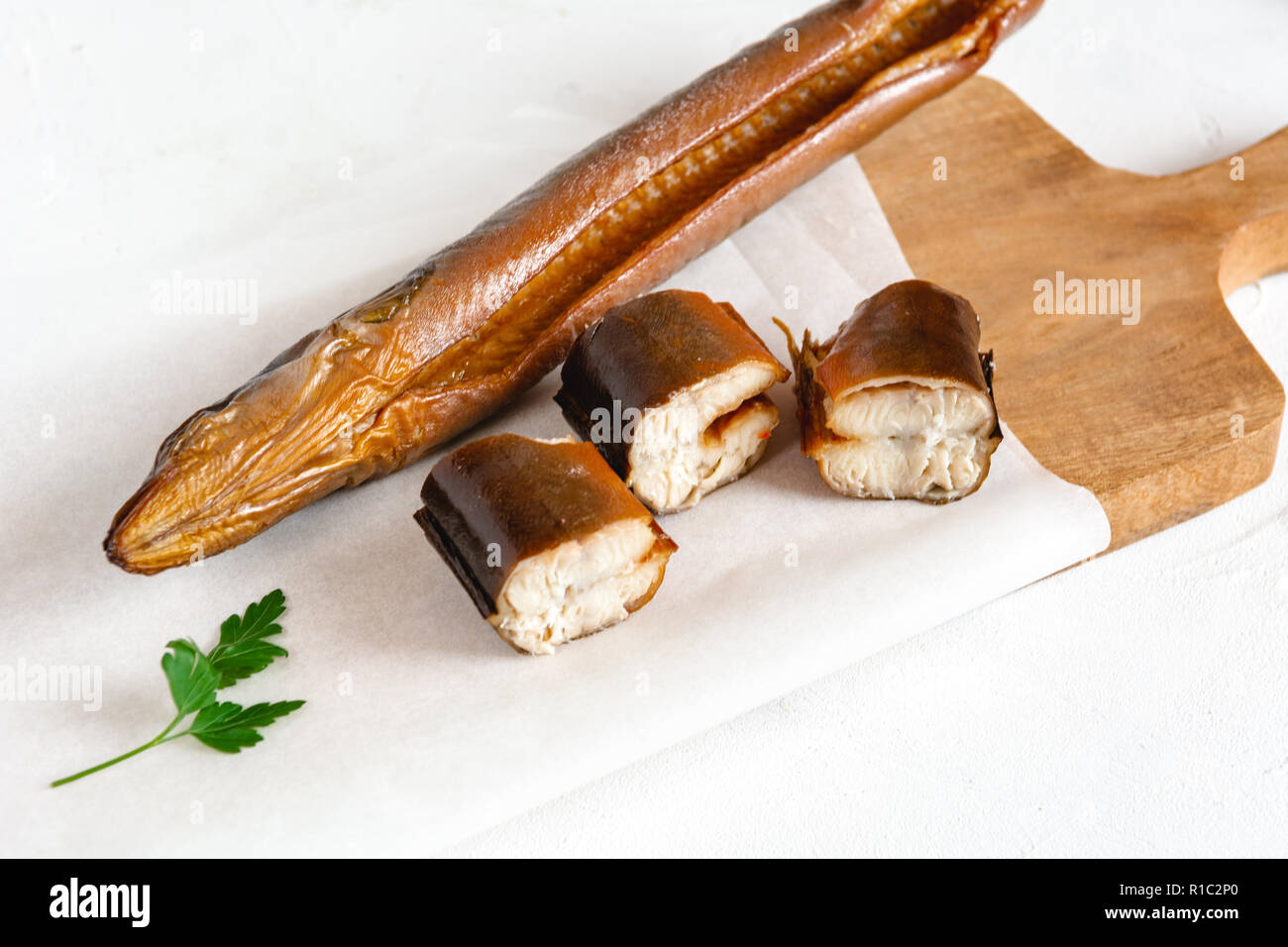 Smoked eel ready to eat. Delicious freshly made seafood Stock Photo - Alamy