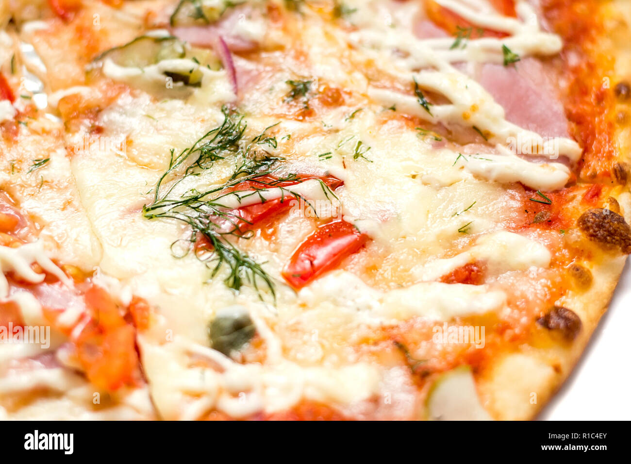 Pizza with bacon, mayonnaise and vegetables closeup isolated on white ...