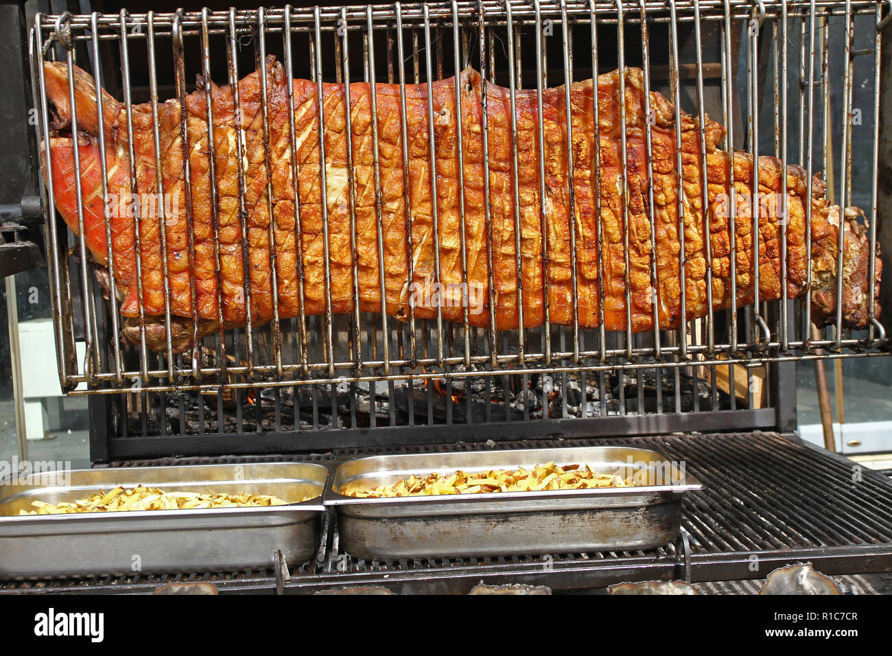 Whole pig roasted on a big grill. Kind of Cheverme, whole animal ...