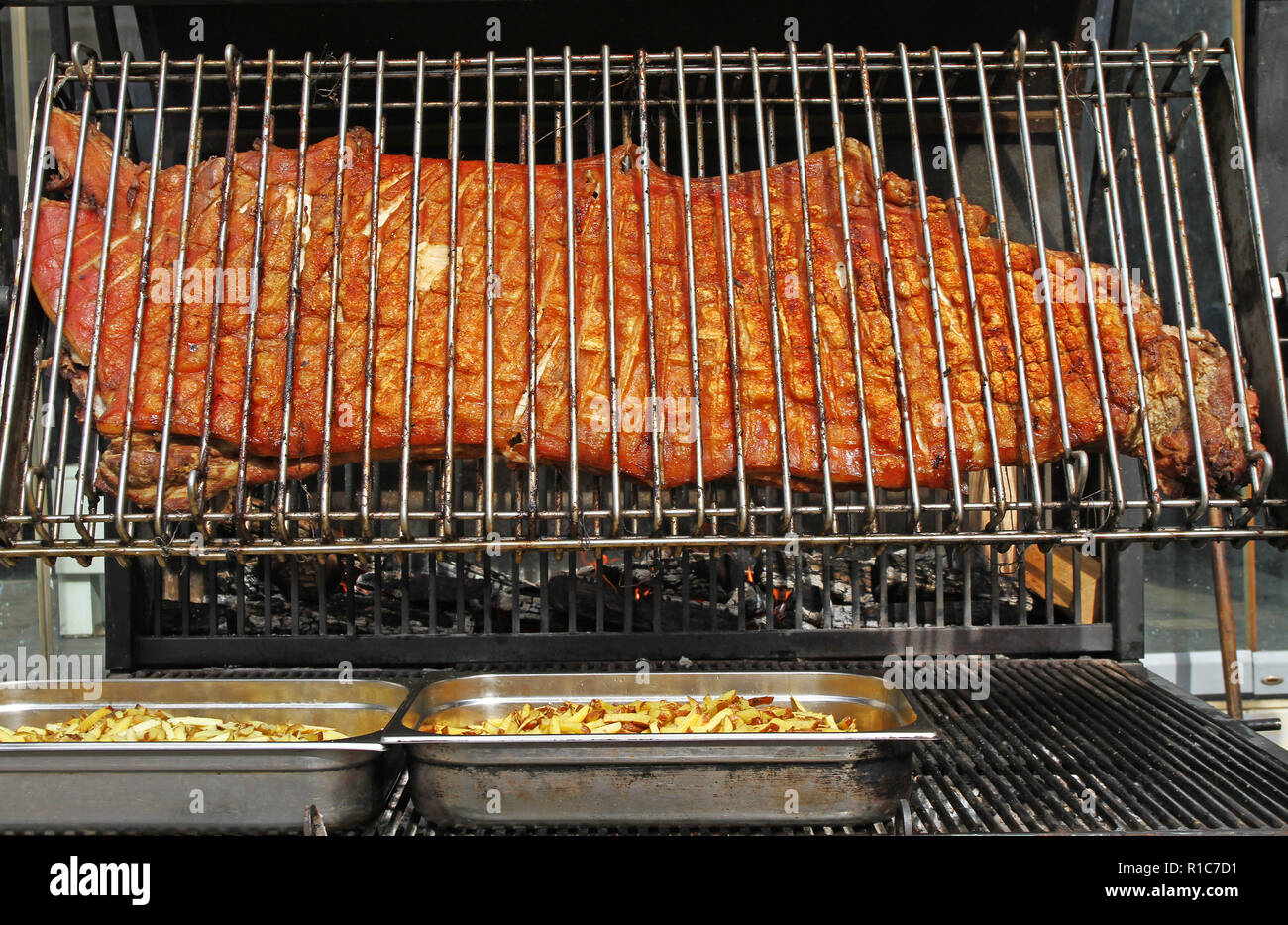 Whole pig roasted on a big grill. Kind of Cheverme, whole animal ...
