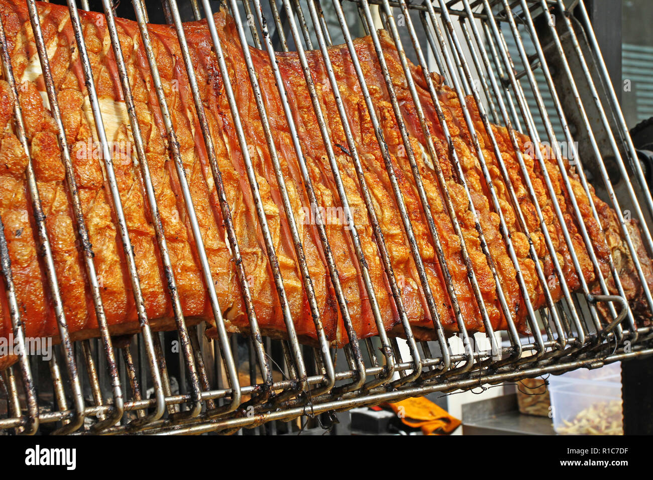 Whole pig roasted on a big grill. Kind of Cheverme, whole animal ...