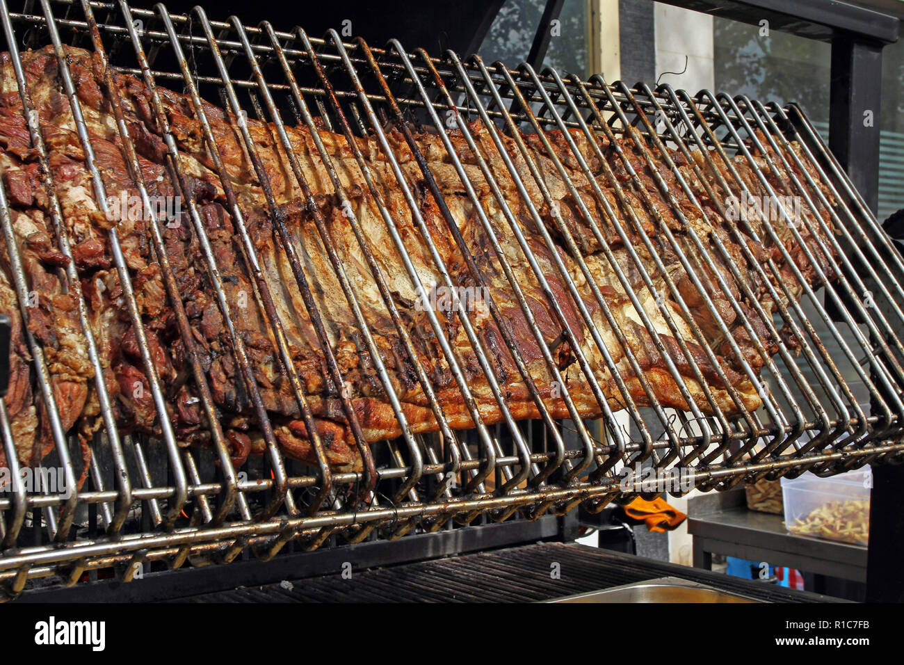 Whole pig roasted on a big grill. Kind of Cheverme, whole animal ...