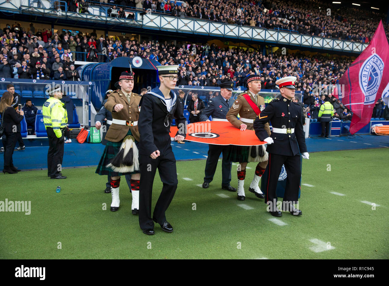 Members of the armed forces carry a poppy for Remembrance Sunday during ...