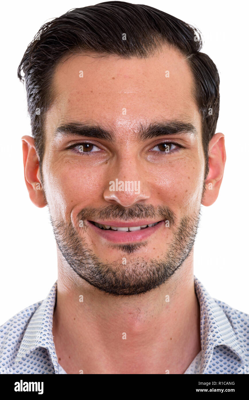 Portrait of a young and happy businessman, isolated on white background ...