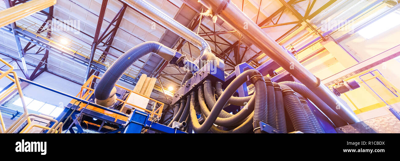 Fiberglass production industry equipment at manufacture background ...