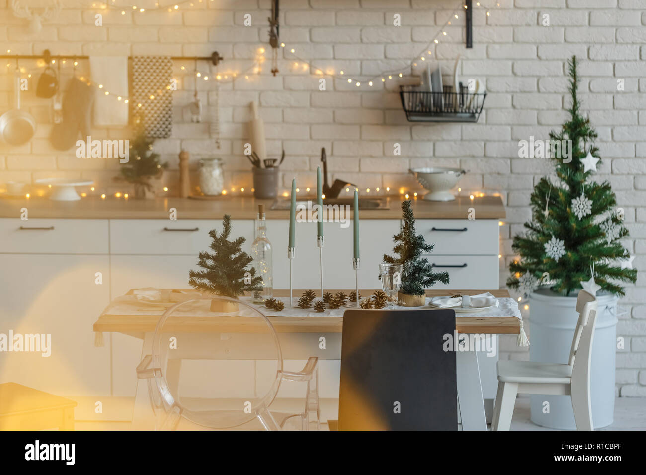 Christmas kitchen table in loft style decoration Stock Photo - Alamy