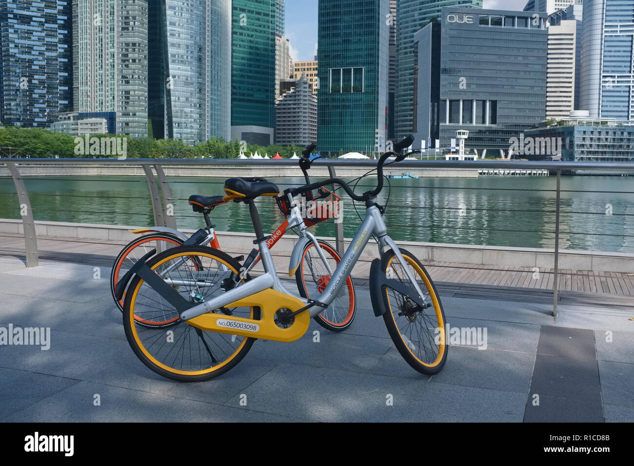 Bicycles of two bike-sharing companies parked at the Event Plaza by Marina Bay and shopping mall ...