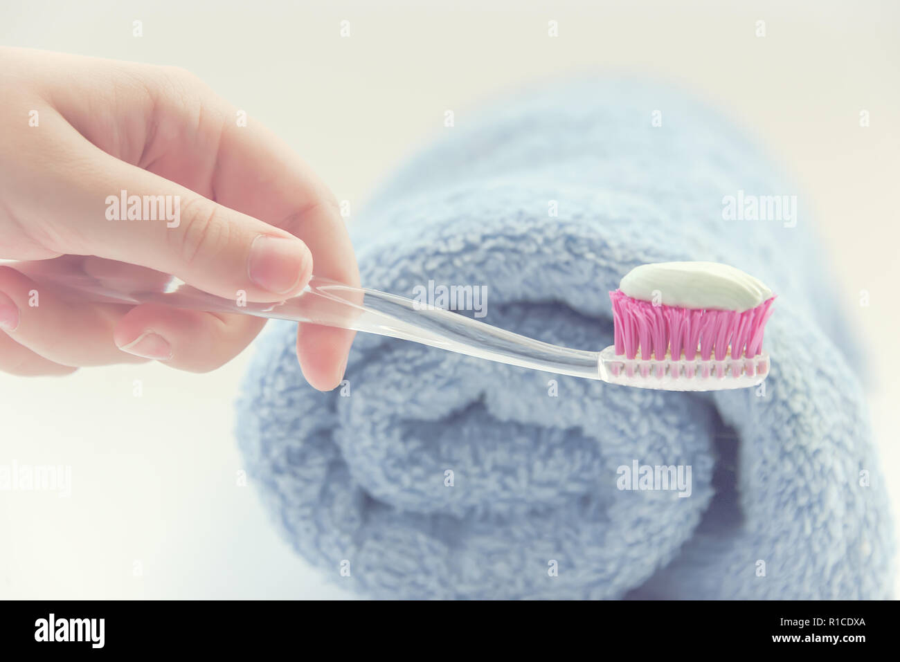 hand holding a toothbrush on a white background. health and beauty ...
