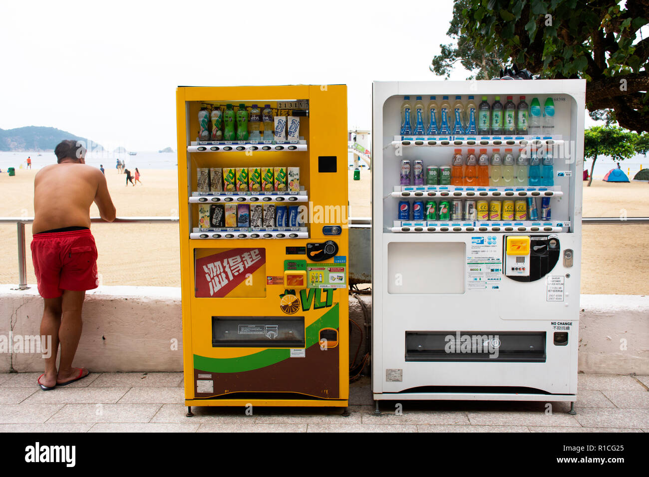 Yellow and white vending automatic machine for people buy water and ...