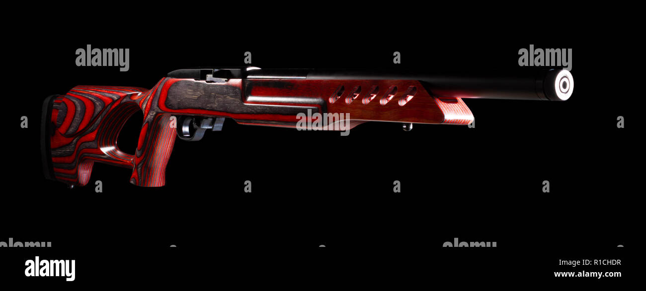 Semi automatic rimfire rifle with a red stock on a black background ...