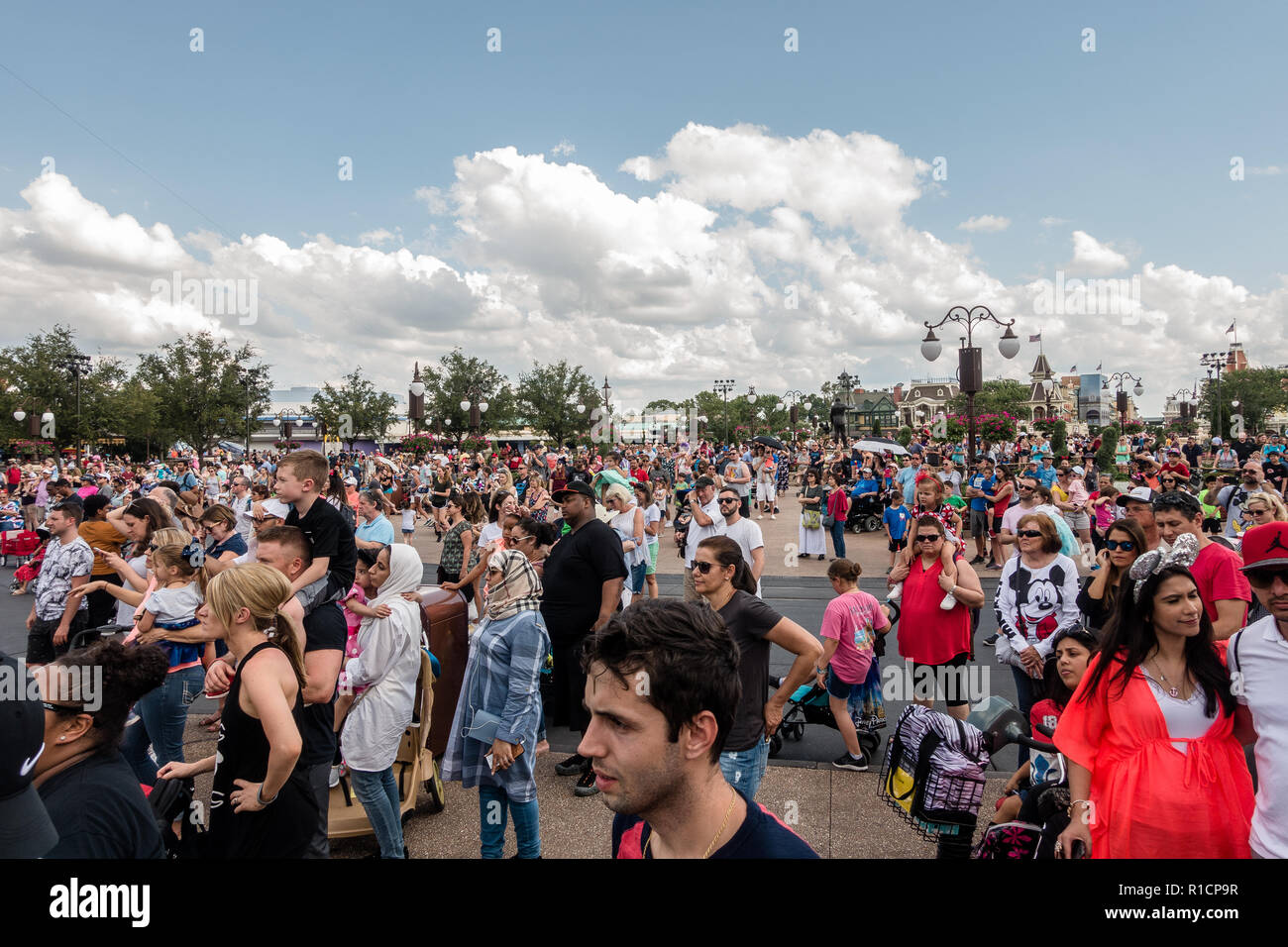 APRIL 25, 2018 - ORLANDO, FLORIDA: PEOPLE WATCH A SHOW AT MAGIC KINGDOM ...