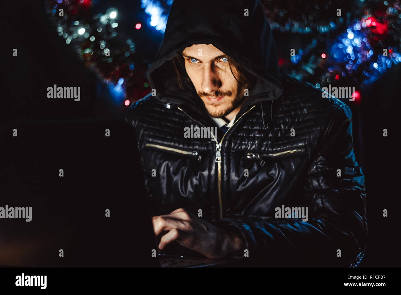 the hacker behind the computer before the new year Stock Photo - Alamy