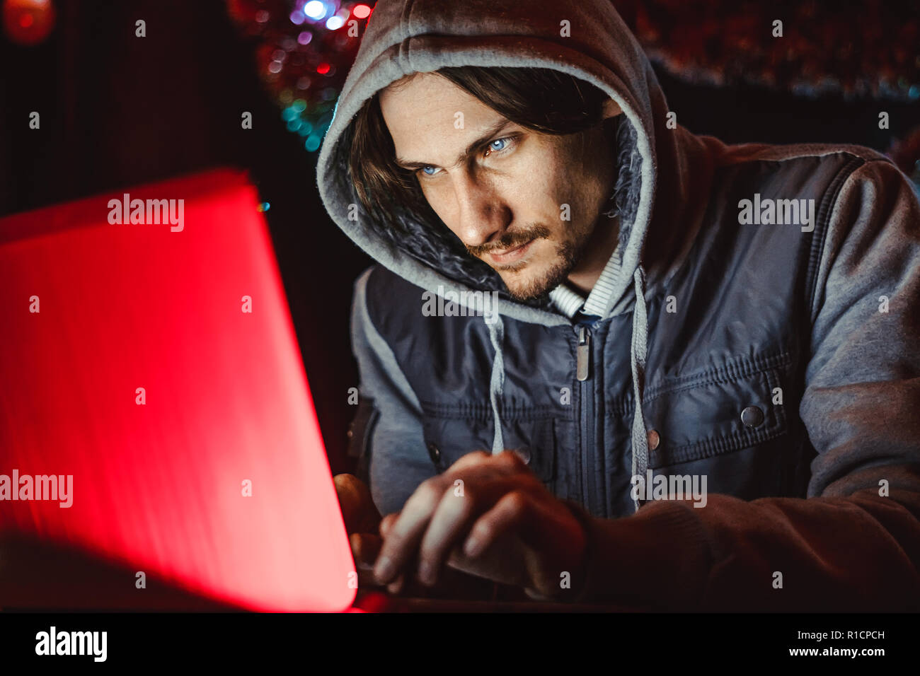 the hacker behind the computer before the new year Stock Photo - Alamy