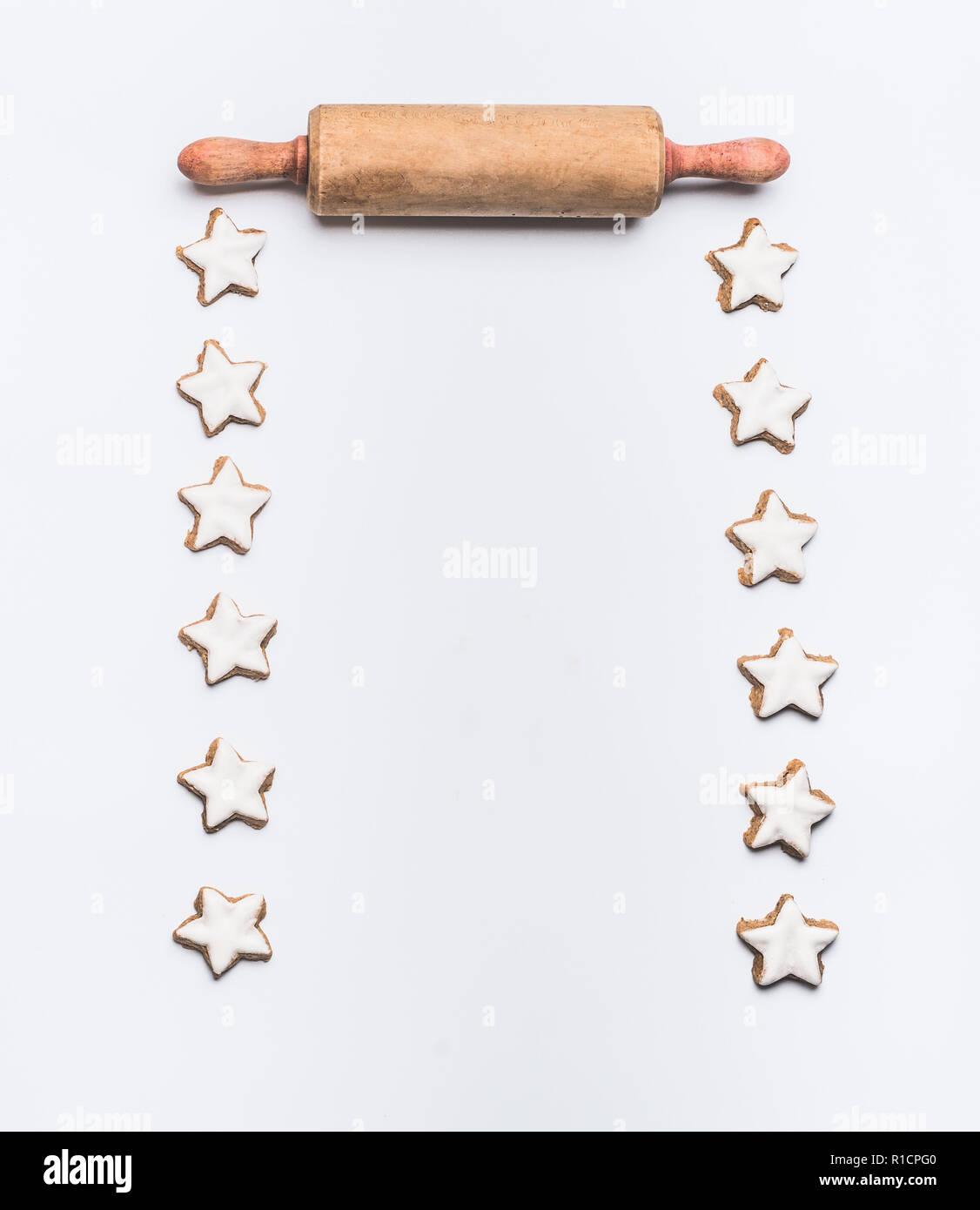 Christmas bake background with cinnamon star cookies and rolling pin on ...