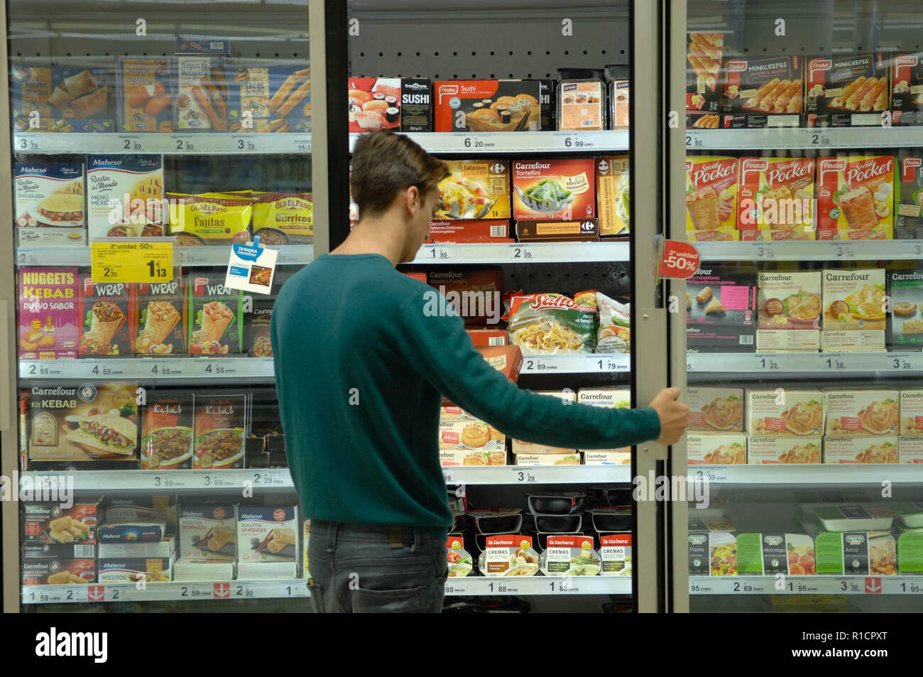 A customer picking up a refrigerated food Stock Photo - Alamy
