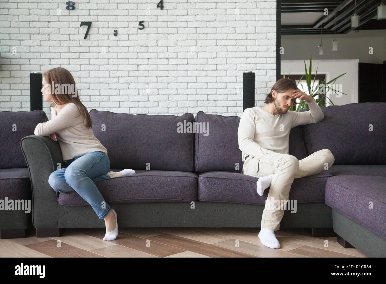 Couple despair sofa hi-res stock photography and images - Alamy