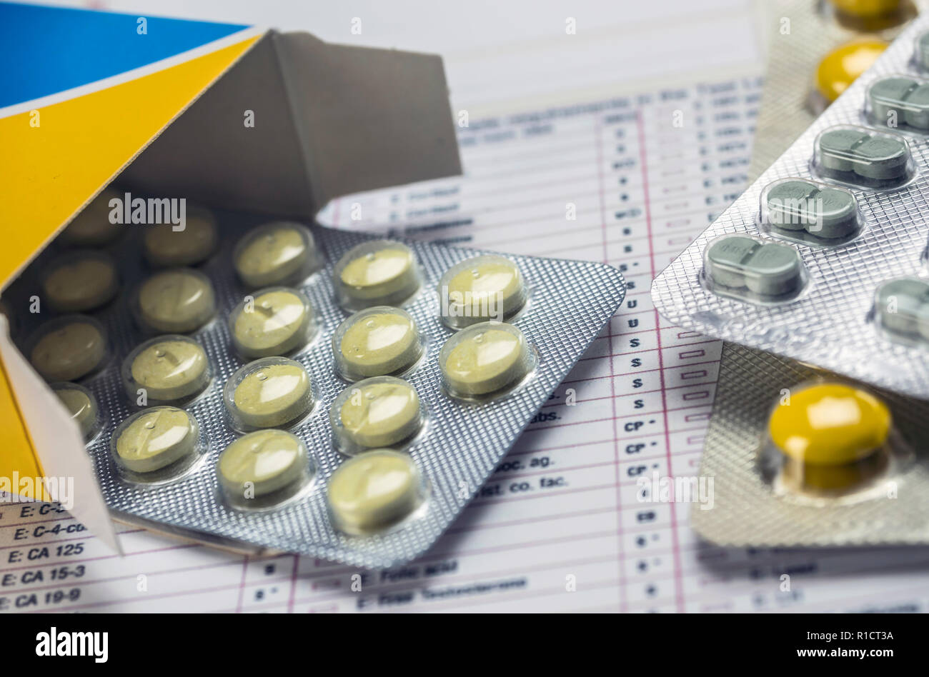 Tablets yellow in a box, conceptual image Stock Photo - Alamy
