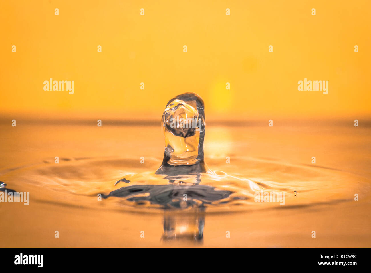 Column of water formed from a water drop Stock Photo - Alamy