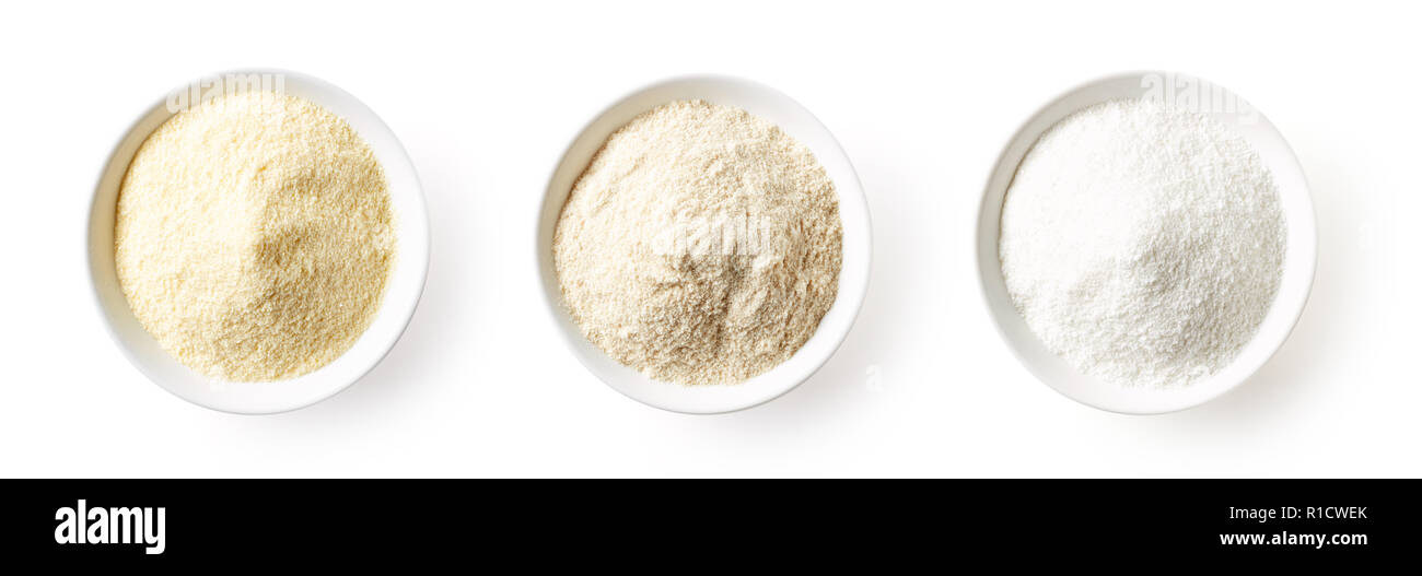 Three bowls of porridge powder for babies isolated on white background ...