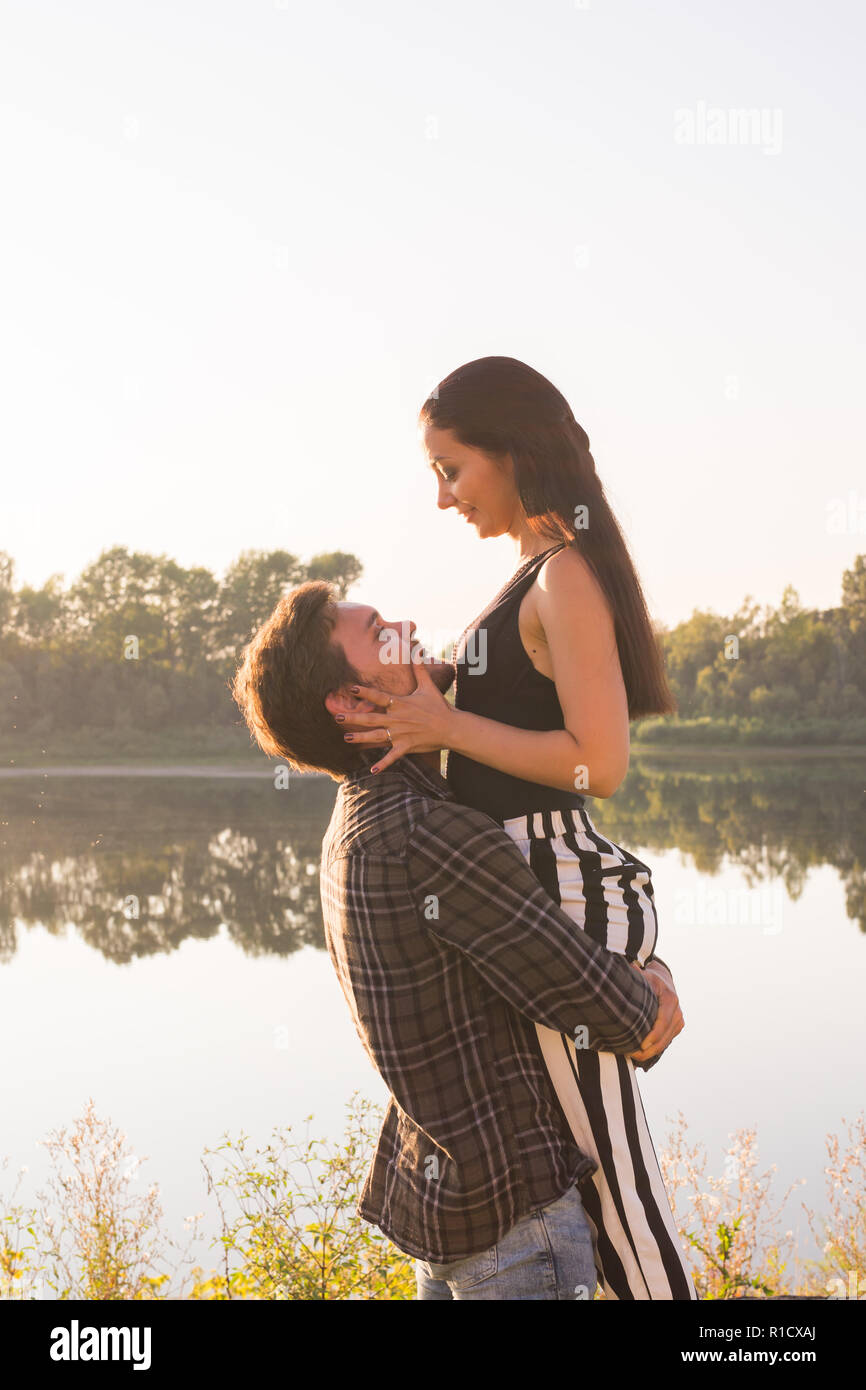 People Love And Nature Concept Man Holding Woman In His Arms Over