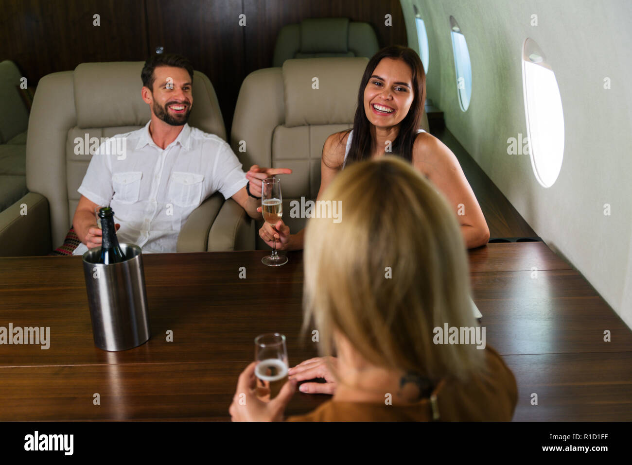Friends travelling on plane hi-res stock photography and images - Alamy