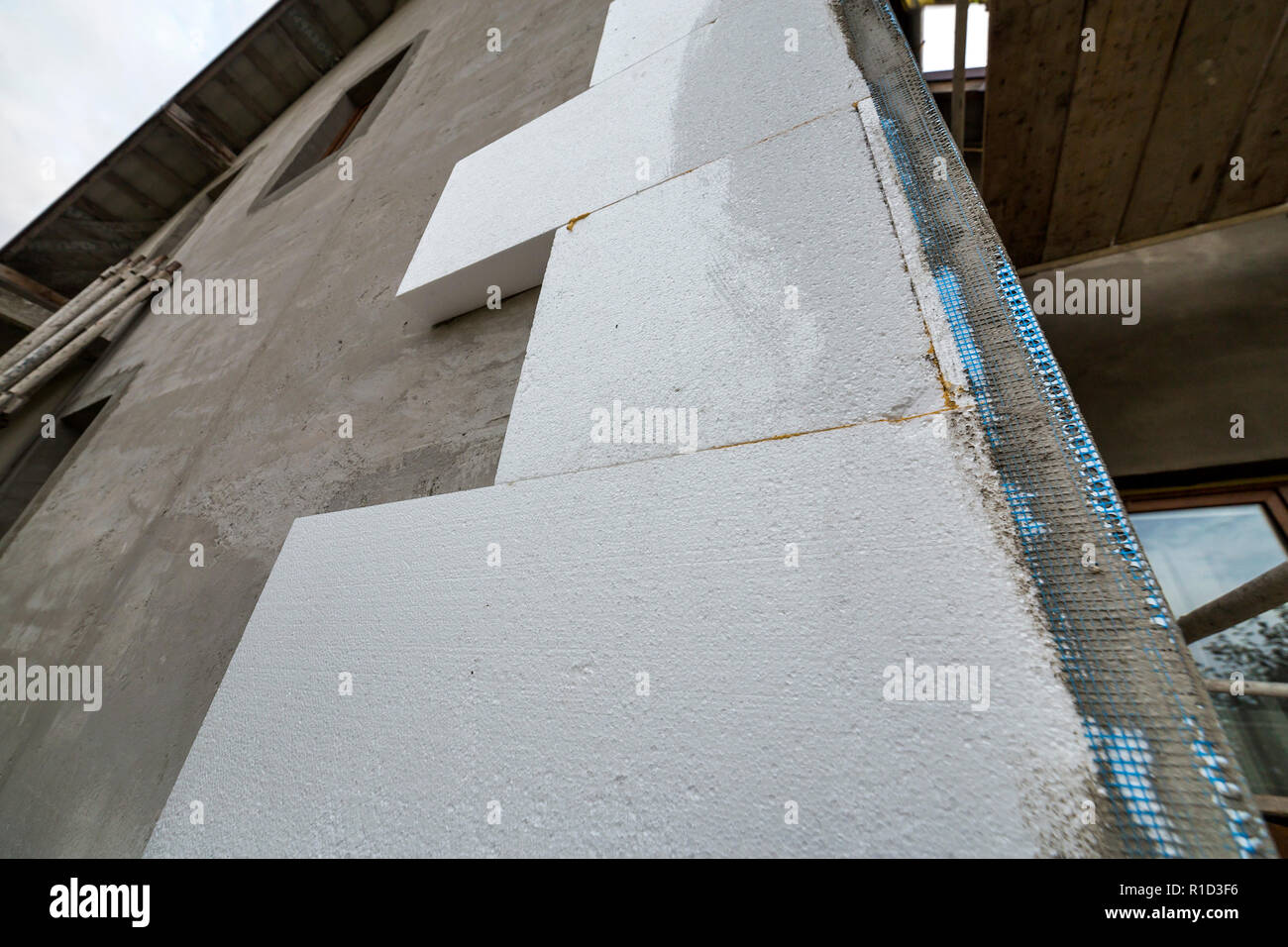 Close-up detail of plastered house wall with rigid styrofoam insulation ...