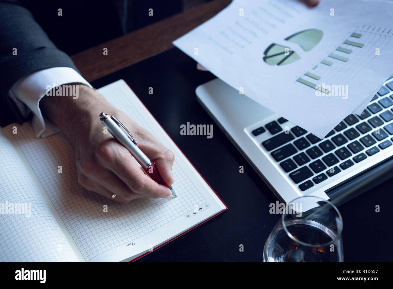 Businessman analyzing investment charts. Accounting. Hands of financial ...