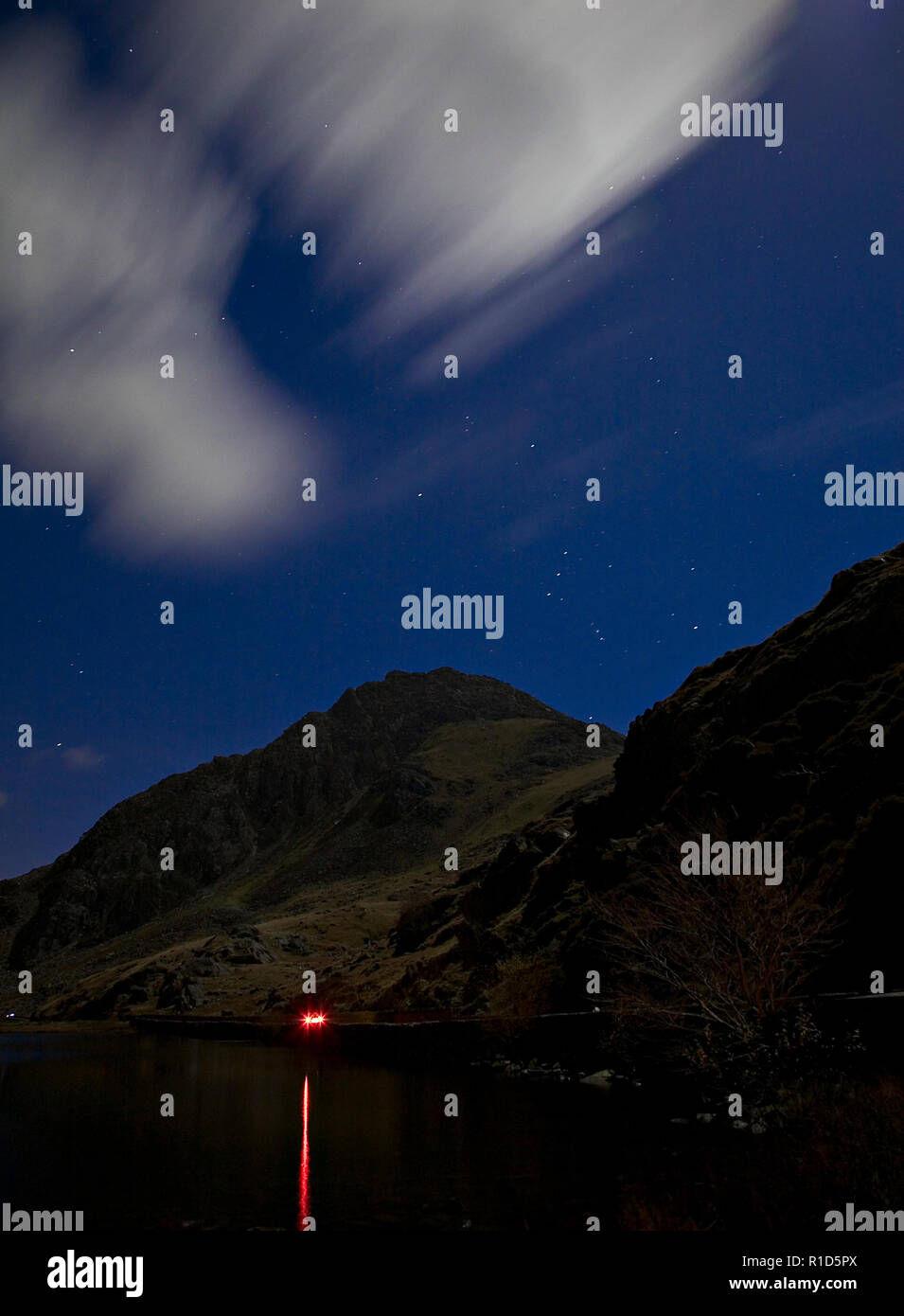 Tryfan mountain at night with traffic trail, Snowdonia, North Wales ...