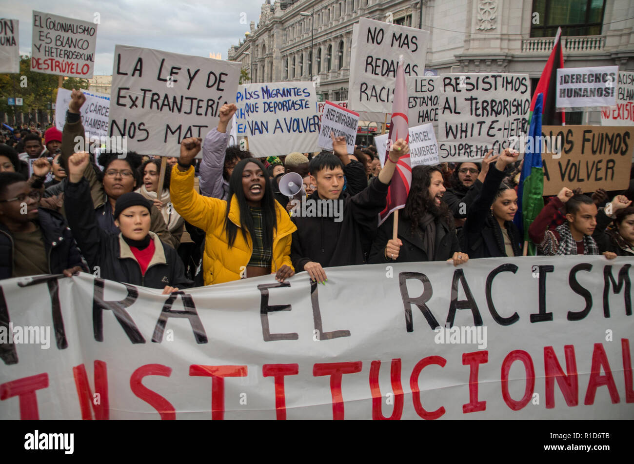 Protesters holding placards and a banner during the demonstration ...