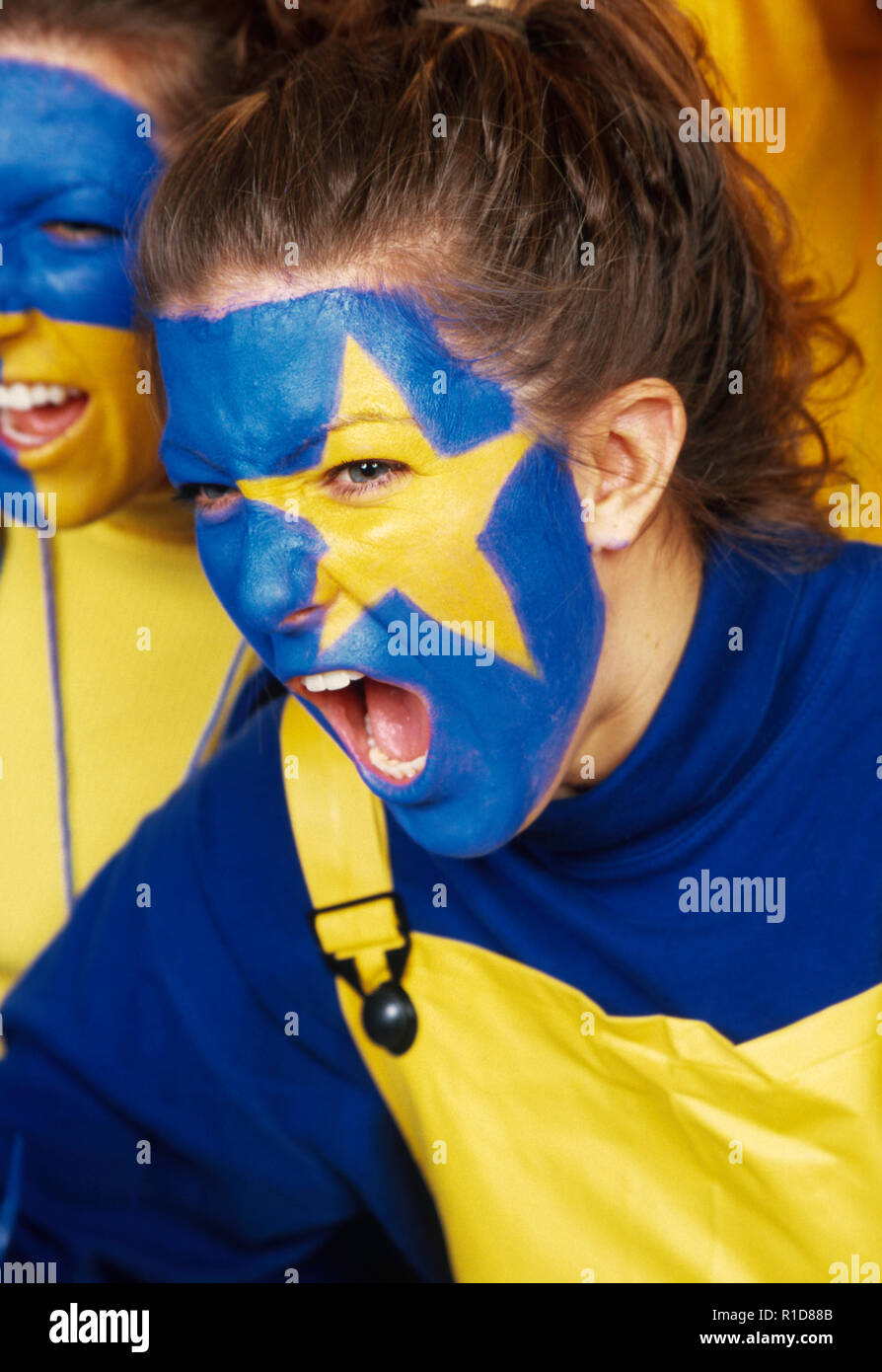 Enthusiastic Sports Fans with Painted Faces at a Game, USA Stock Photo ...