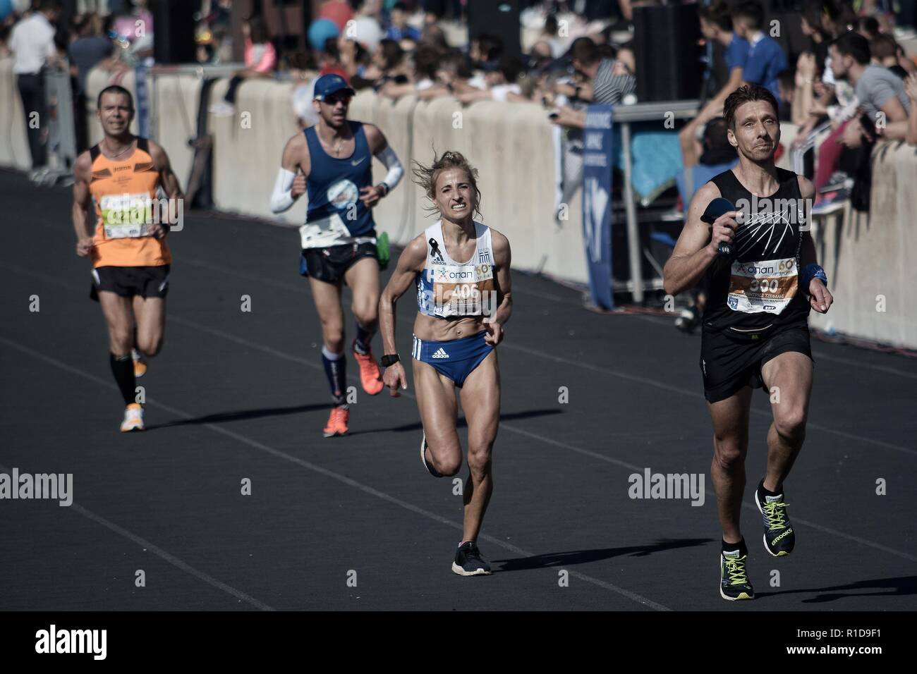 Athens, Greece. 11th Nov, 2018. Marathon athletes are seen running ...