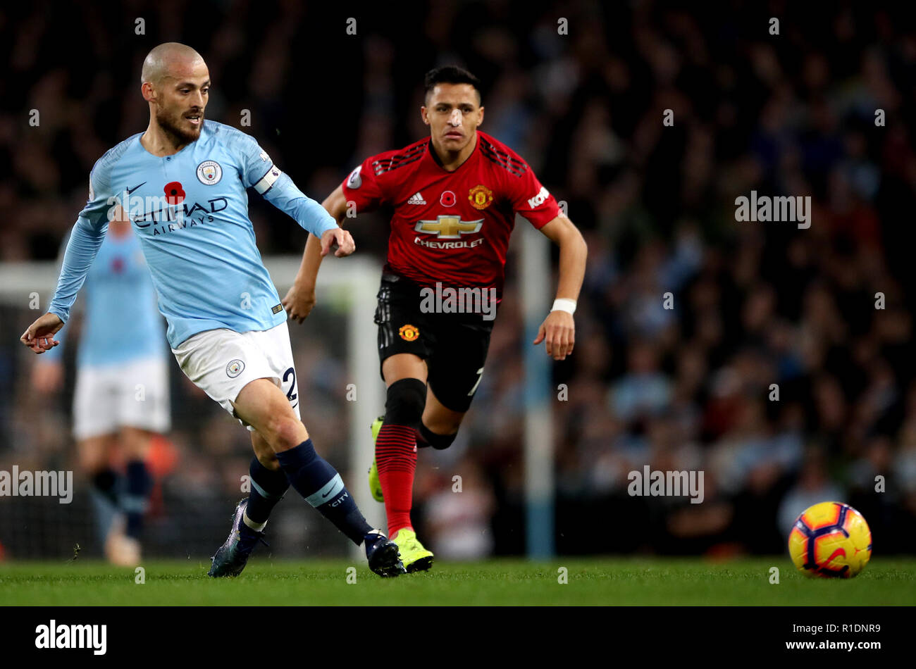 Manchester City's David Silva (left) and Manchester United's Alexis ...
