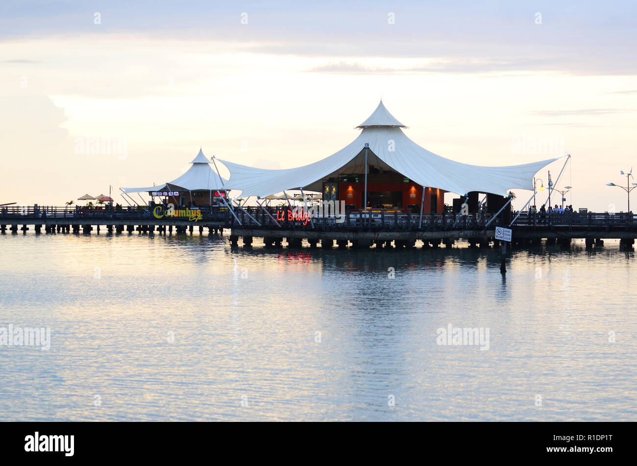 La Bridge restaurant, in Ancol beach, Jakarta, in low light sunset in ...