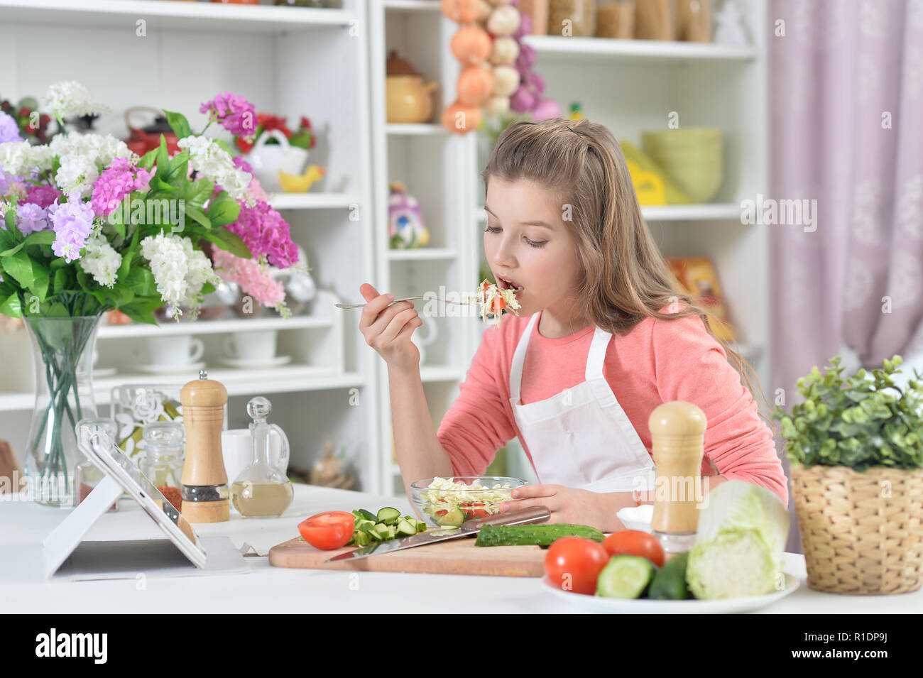 Young girl cooking in kitchen at home Stock Photo - Alamy